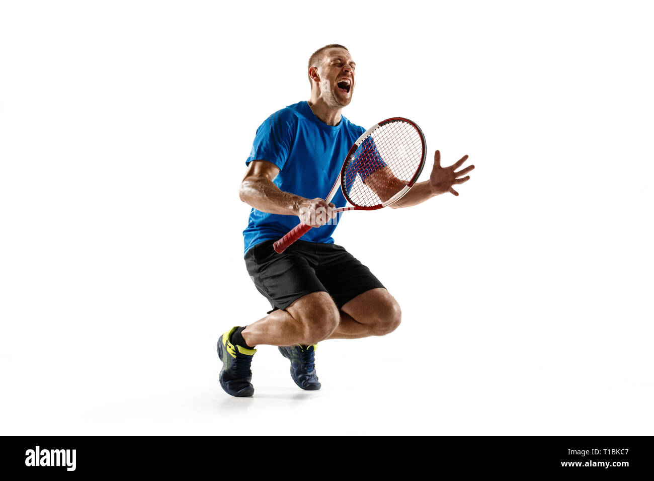 Portrait of a handsome male tennis player celebrating his success ...