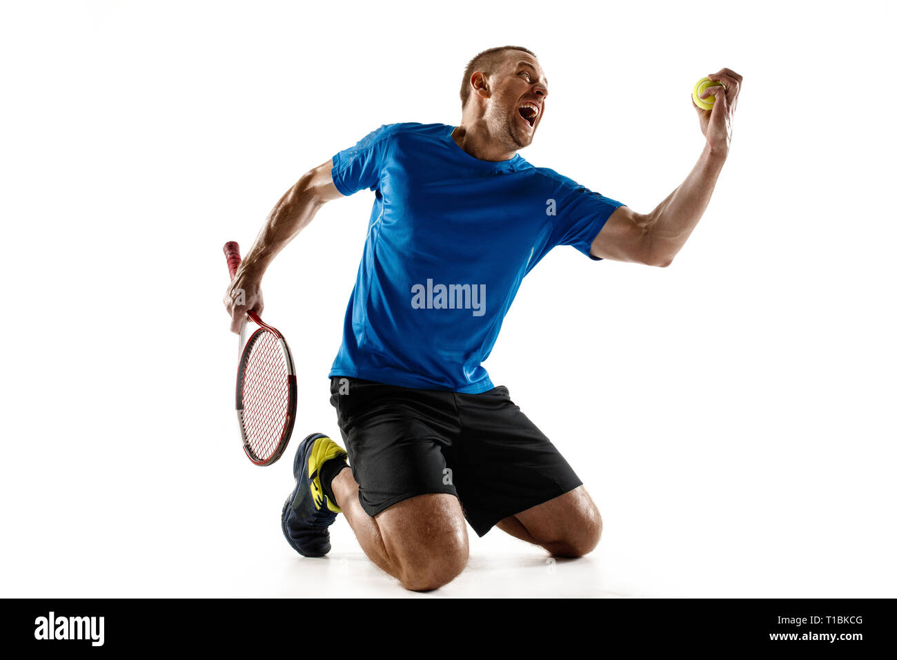 Portrait of a handsome male tennis player celebrating his success ...