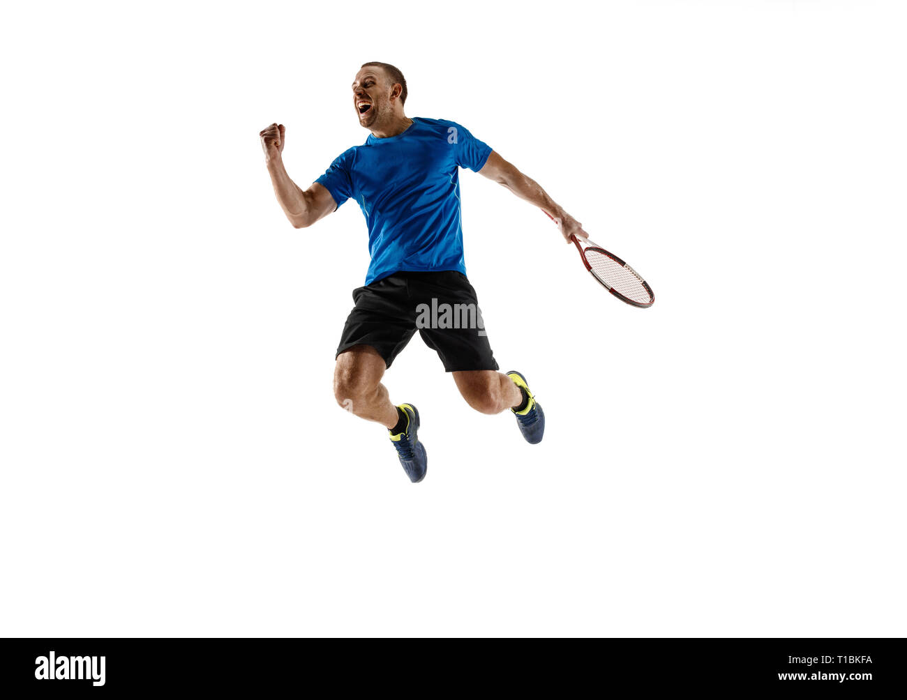 Portrait of a handsome male tennis player celebrating his success ...