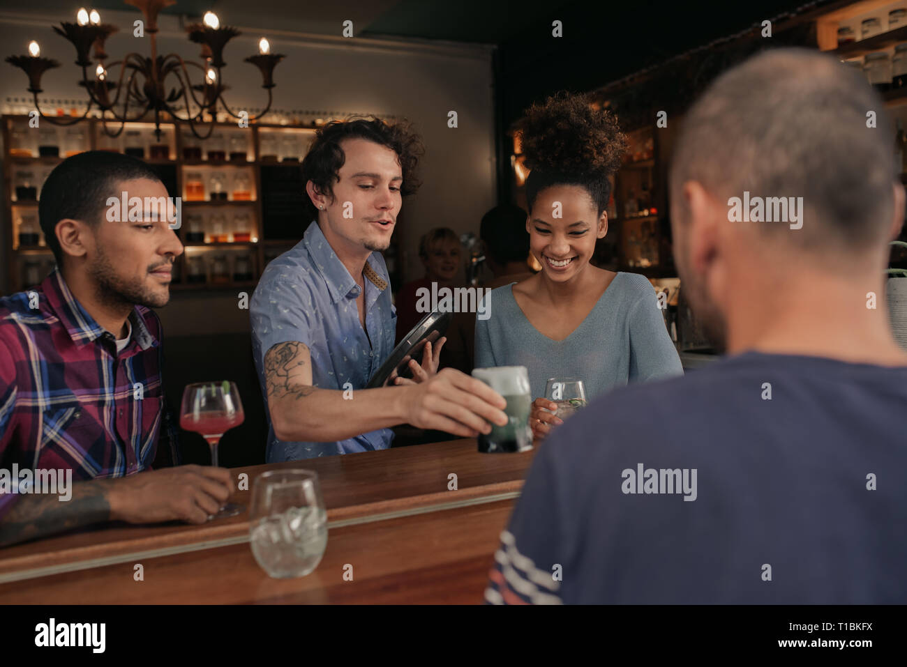 Asian woman drinking at bar hi-res stock photography and images - Alamy