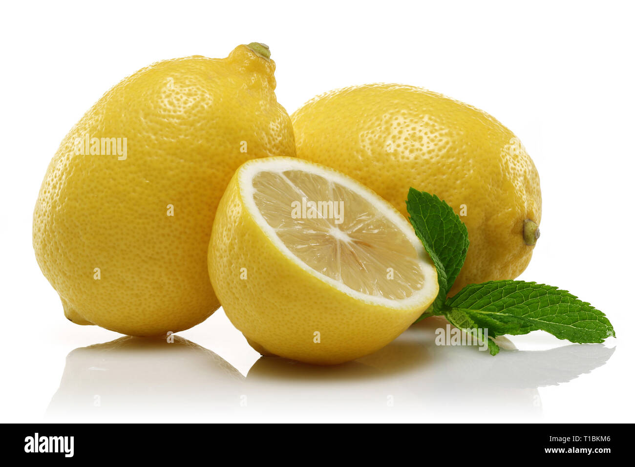 Fresh lemon fruits with leaves isolated on white background Stock Photo ...