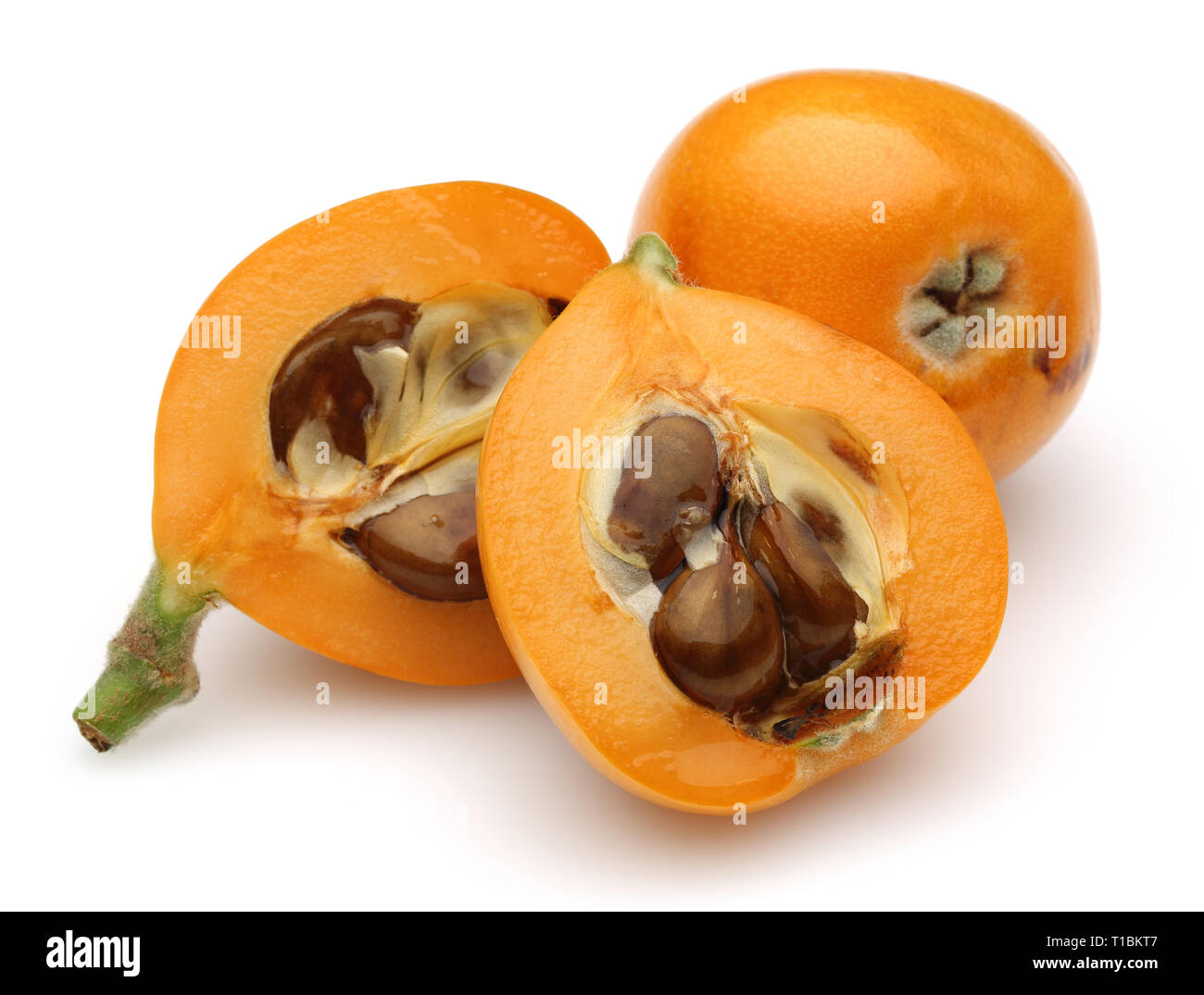 Half and whole ripe loquat fruits isolated on white background Stock ...