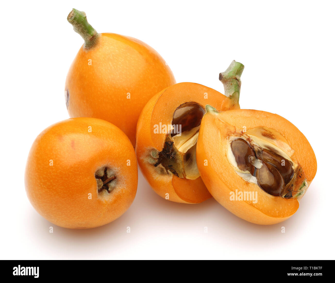Half and whole ripe loquat fruits isolated on white background Stock ...