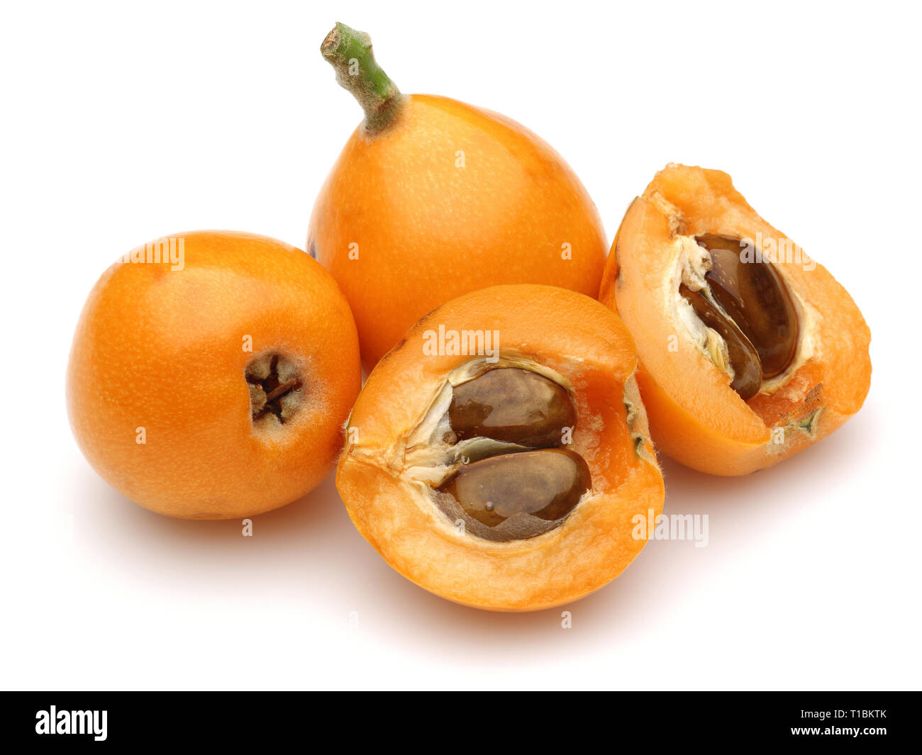 Half and whole ripe loquat fruits isolated on white background Stock ...