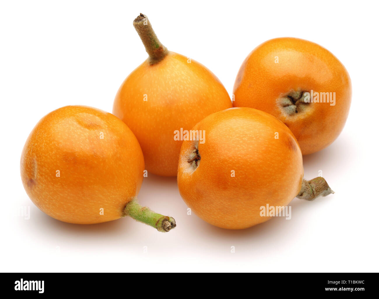 Ripe loquat fruits isolated on white background Stock Photo - Alamy
