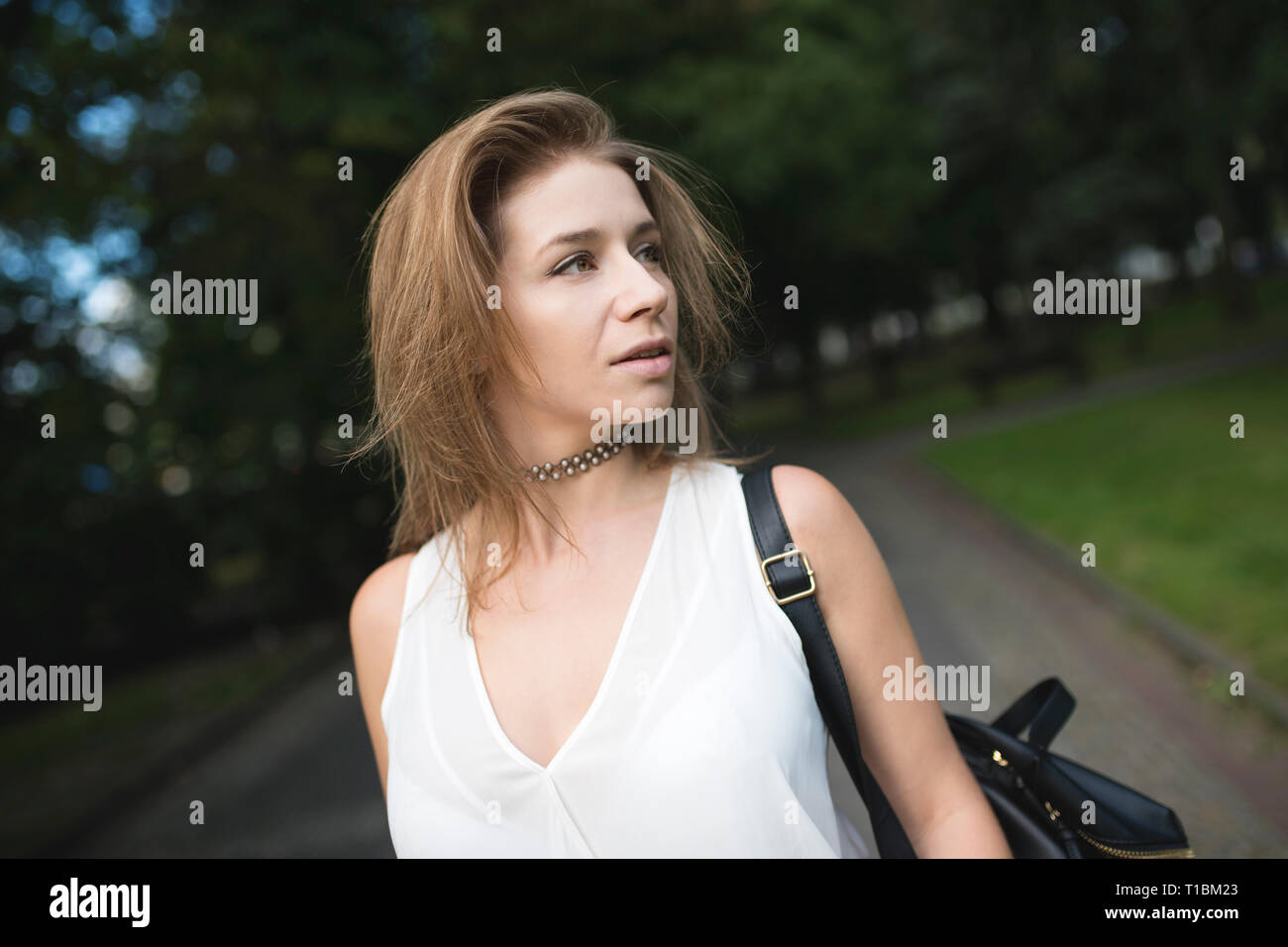 Portrait of young woman when she look in other side, with emotion on ...