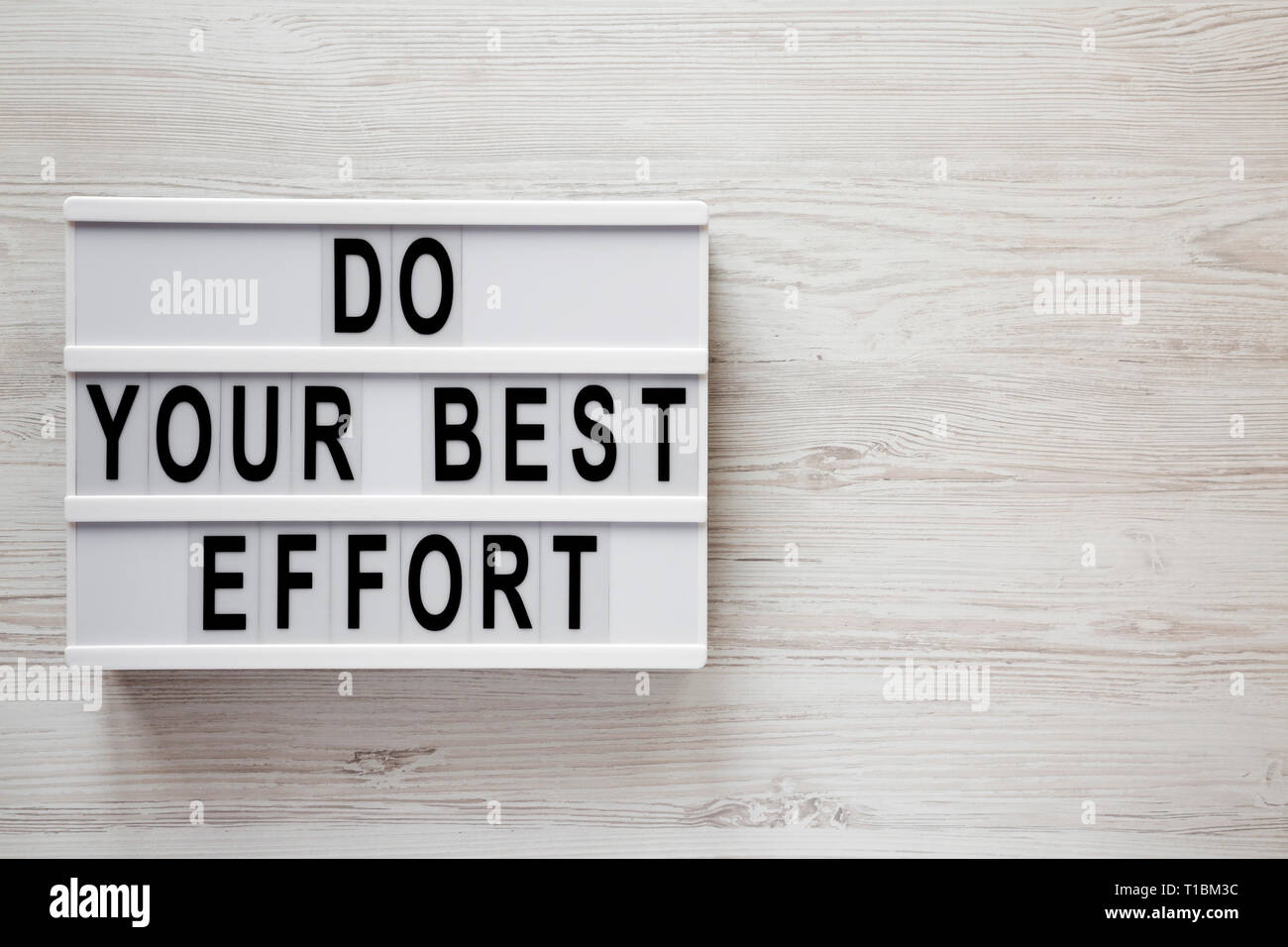 'Do your best effort' words on modern board over white wooden ...