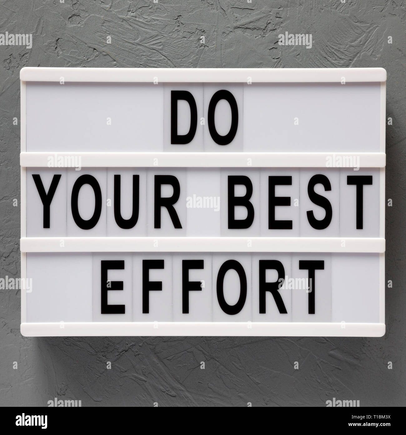 'Do your best effort' words on lightbox over gray background, top view ...