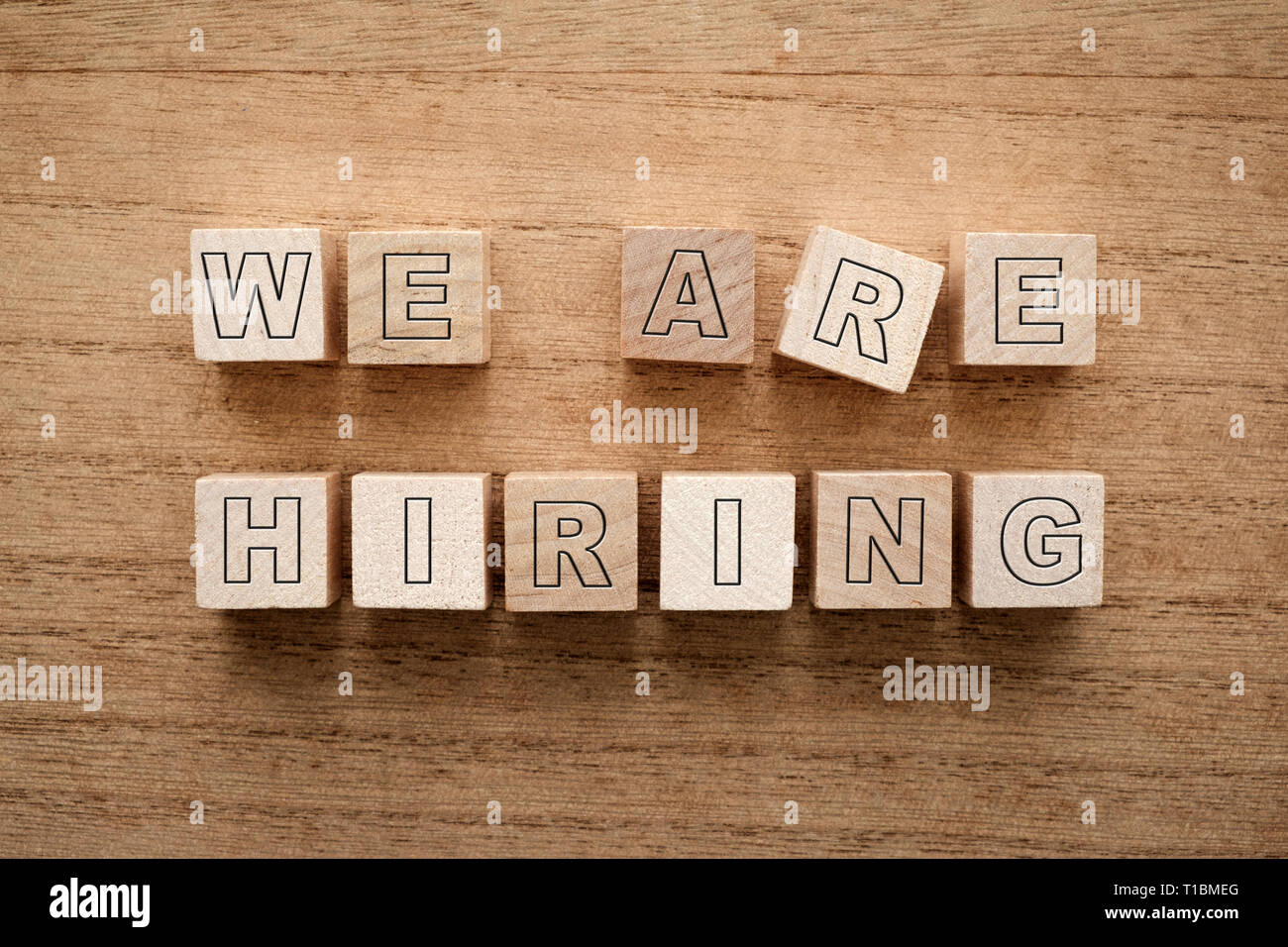 We are hiring wooden cube blocks Stock Photo - Alamy