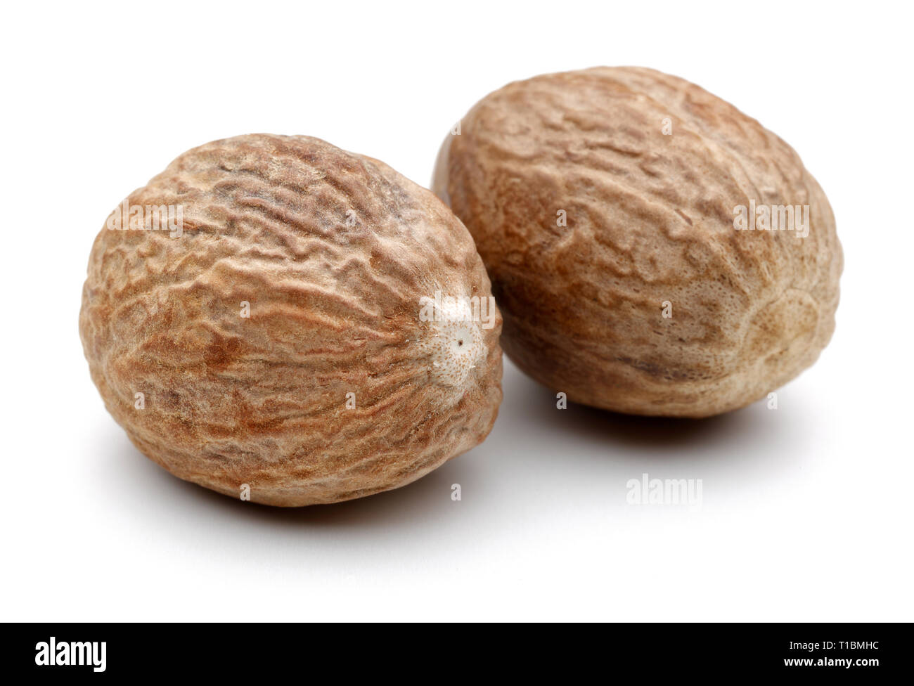 Group of whole nutmeg isolated on white background Stock Photo - Alamy