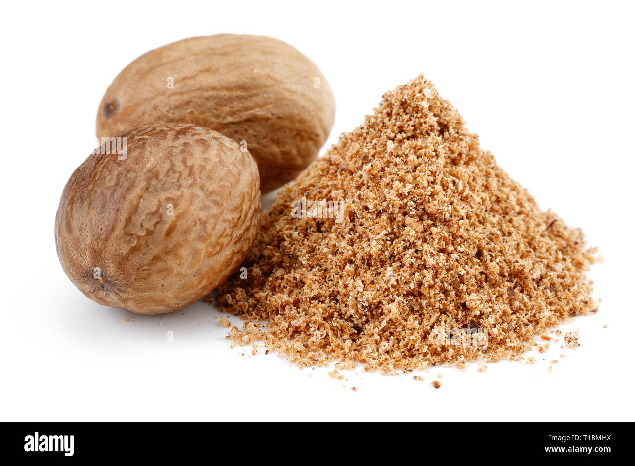 Whole and grated nutmeg isolated on white background Stock Photo - Alamy