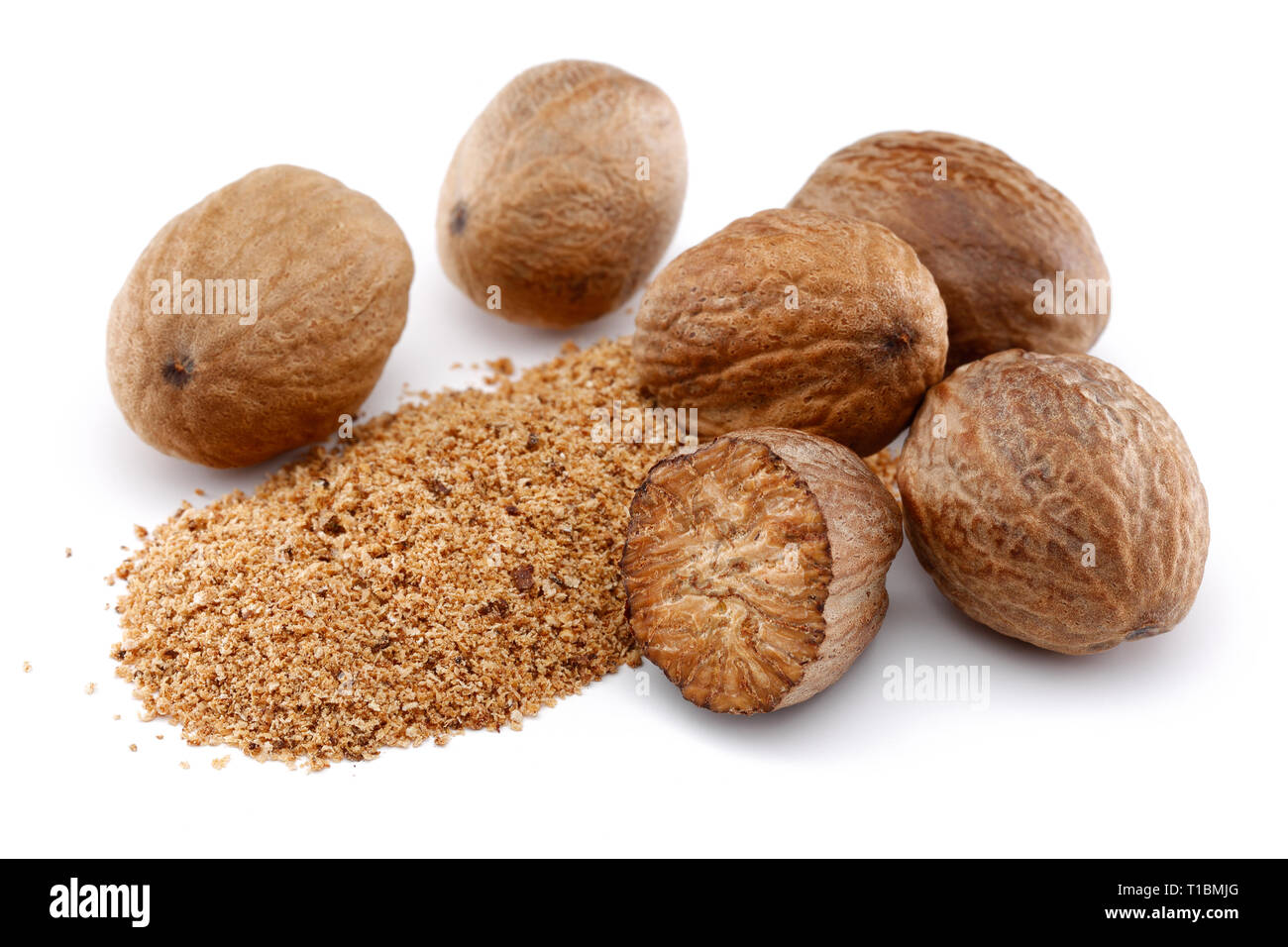 Whole and grated nutmeg isolated on white background Stock Photo - Alamy