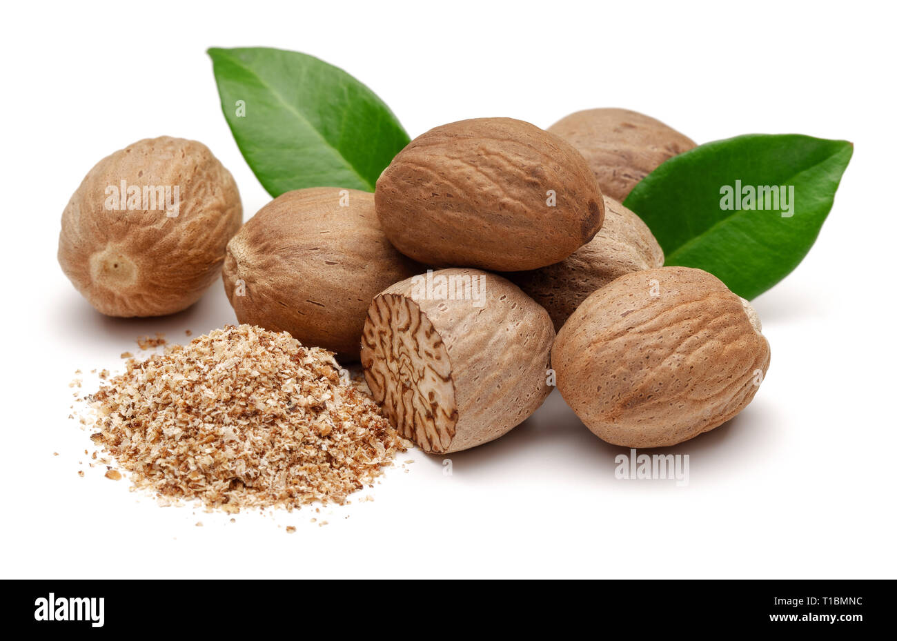 Whole and grated nutmeg with leaves isolated on white background Stock ...
