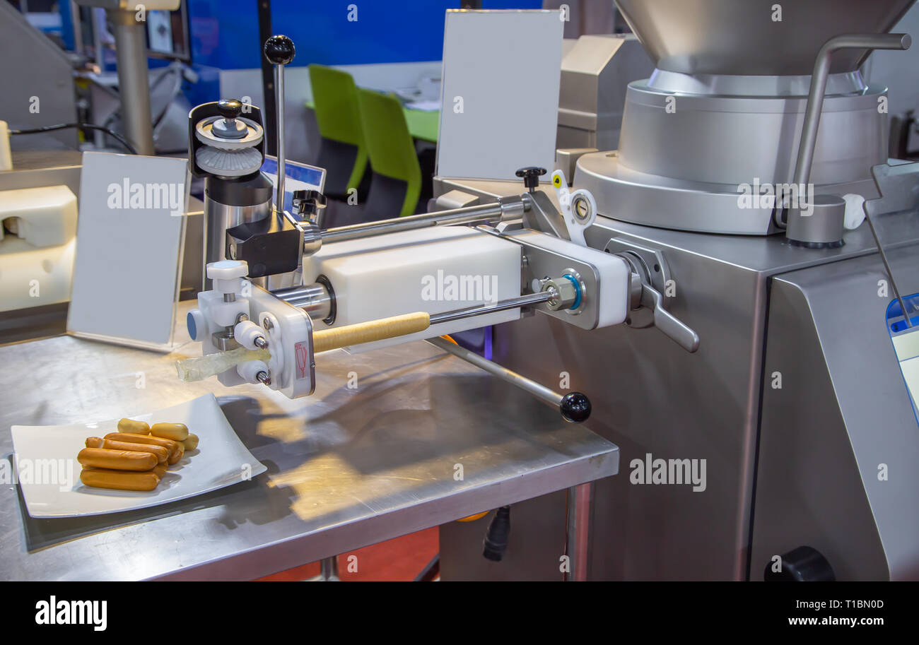 Industrial Vacuum meat sausage stuffing making machine Stock Photo - Alamy