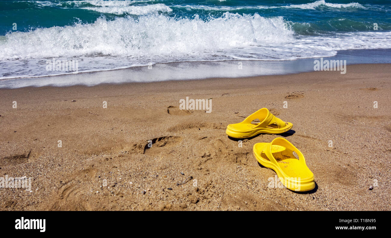 Blue yellow rubber slippers hi-res stock photography and images - Alamy