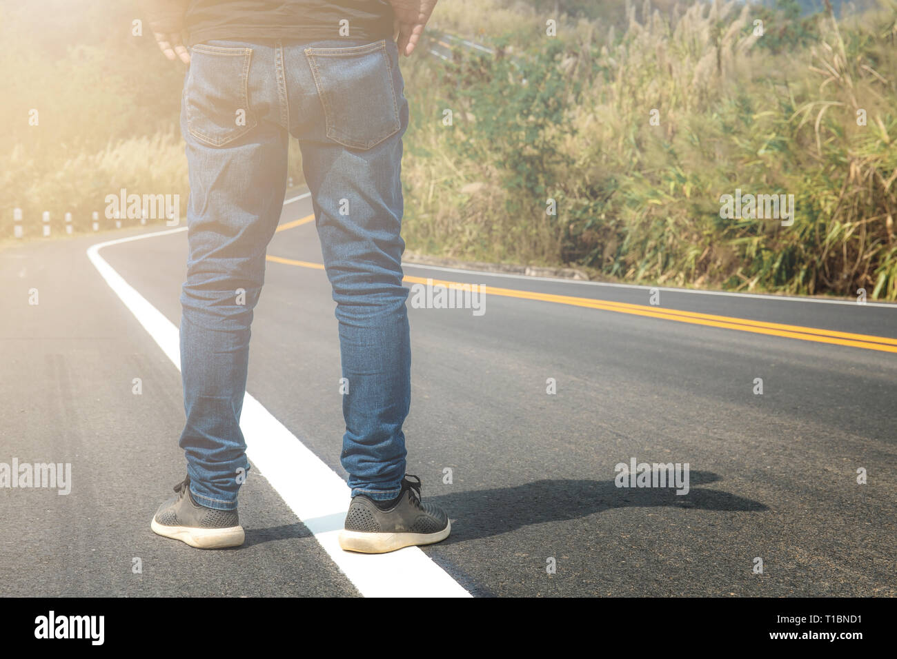 Man are standing on street in countryside with sunlight Stock Photo - Alamy
