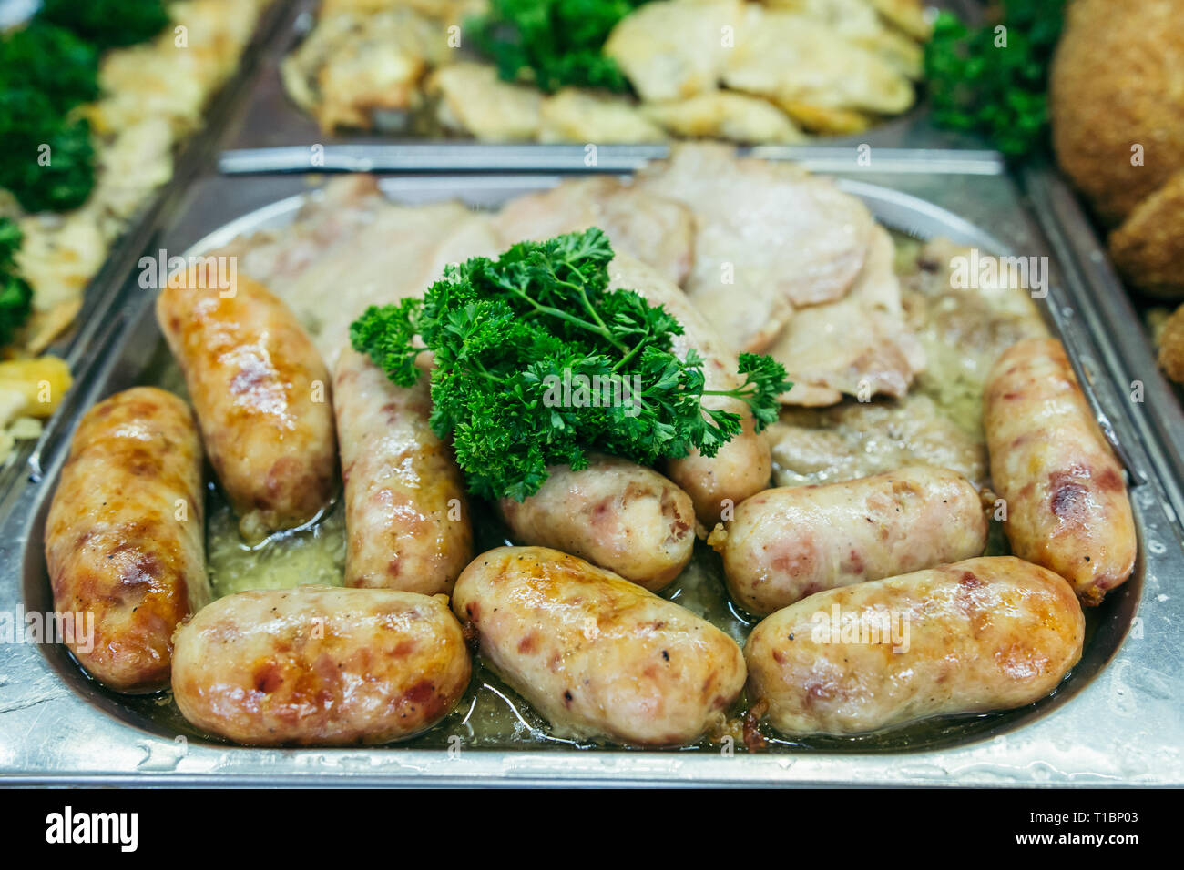 A set of meat dishes in the trays, a banquet table Stock Photo - Alamy