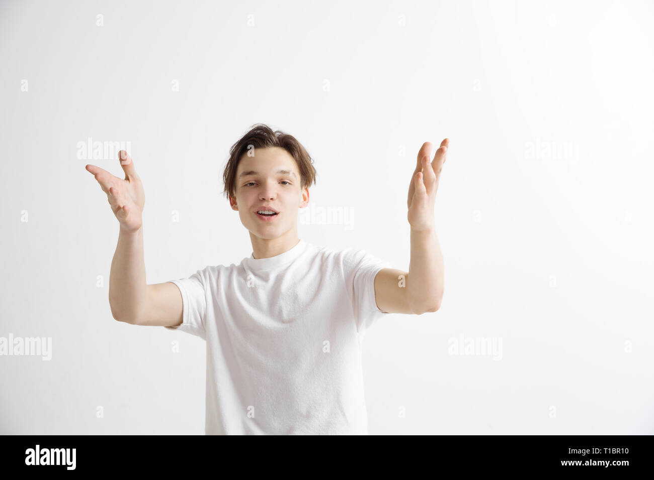 Happy business man standing, smiling isolated on gray studio background ...