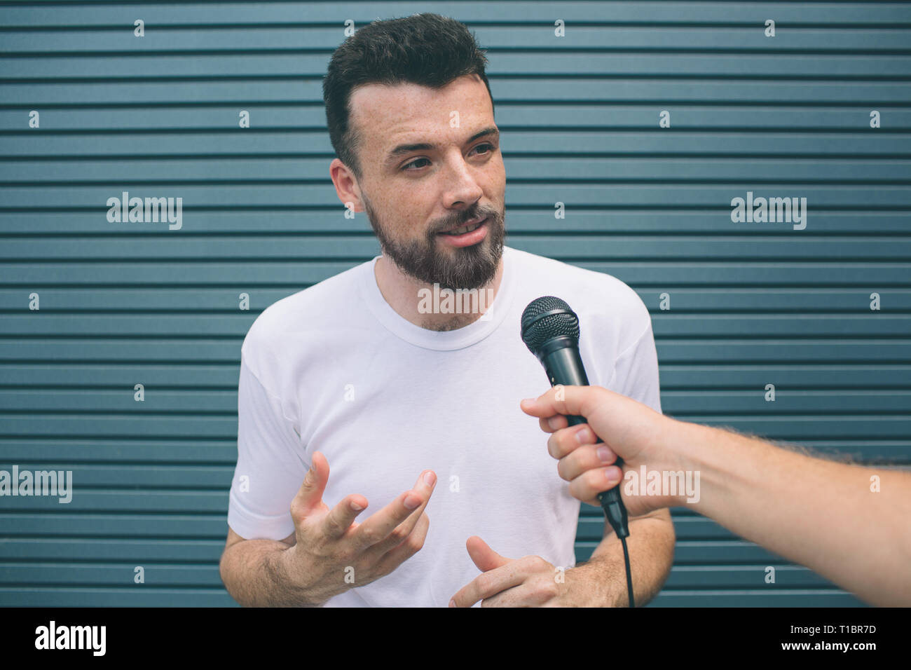 Holding mic with both hands hi-res stock photography and images - Alamy