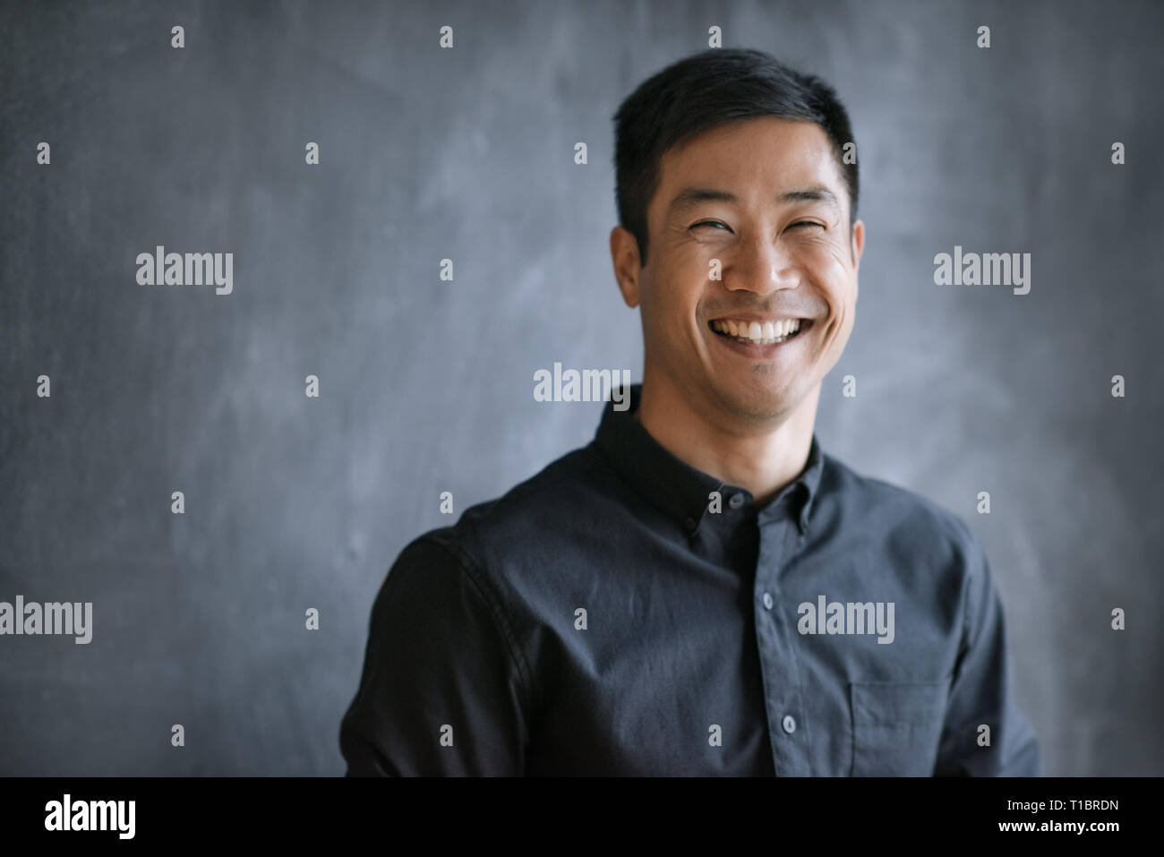 Asian professional man standing hi-res stock photography and images - Alamy