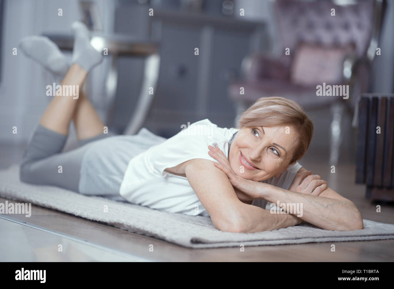 Joyful Woman Over 50 Years Old Lying on the Floor After Yoga Stock ...