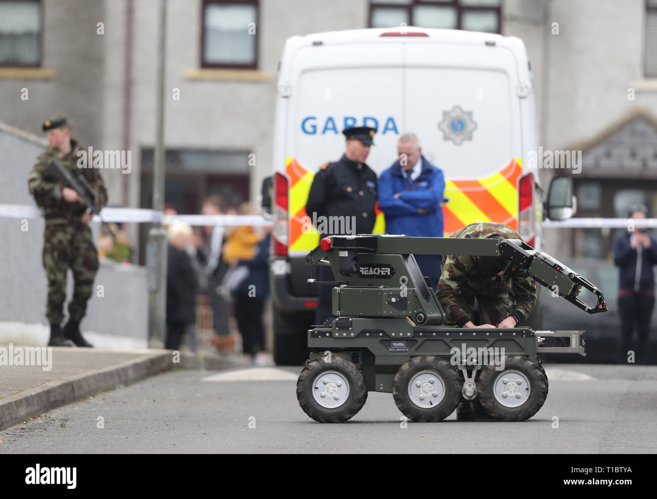Gardai and an army bomb disposal robot at the scene of an unexploded ...