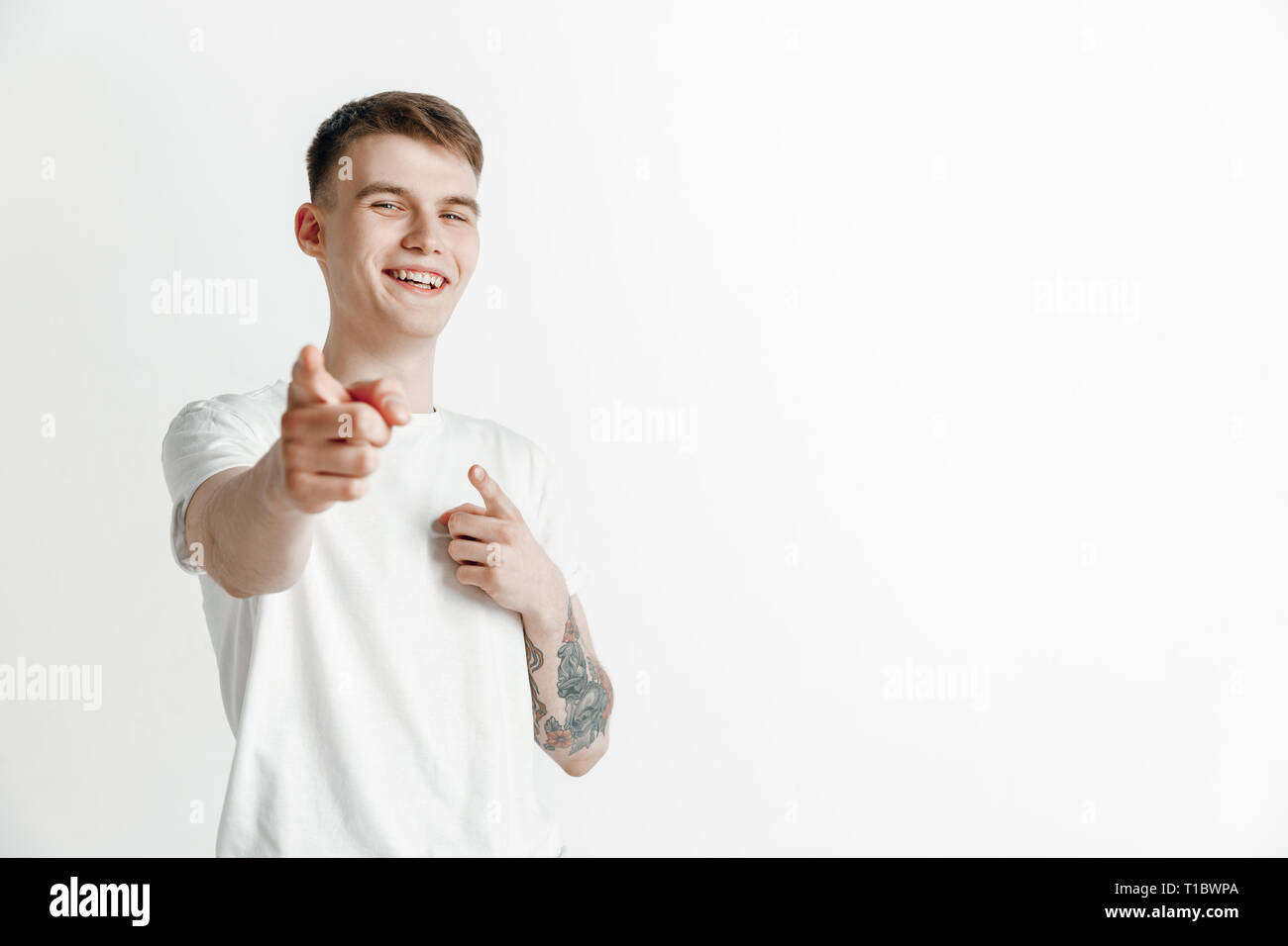 Happy business man standing, smiling, pointing to camera isolated on ...
