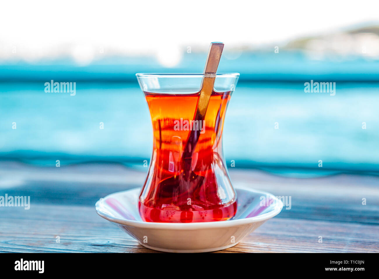 Traditional Turkish tea in a cup in the shape of a tulip on the ...