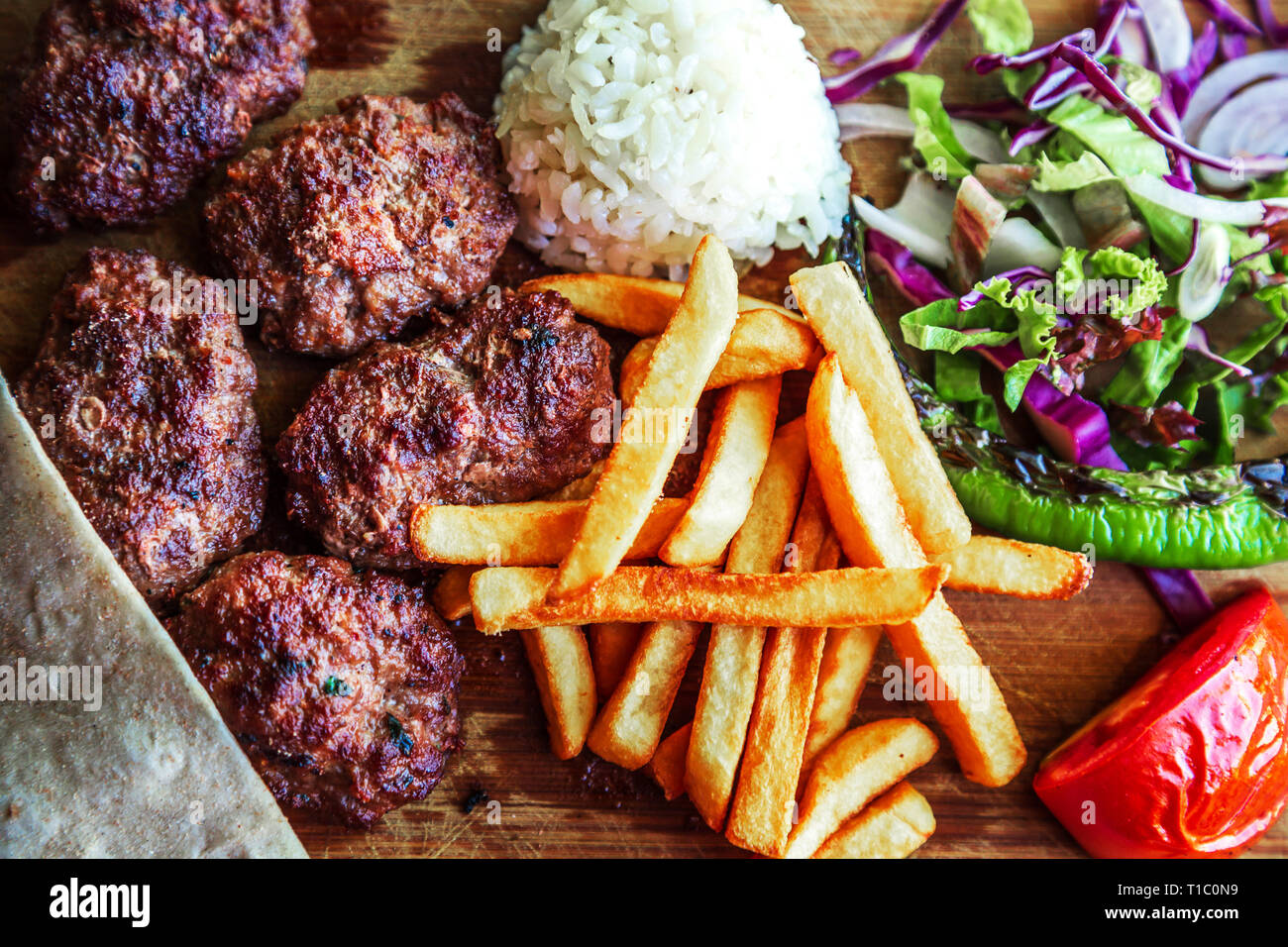 Traditional Turkish meat balls - "kofte". Served with fried potatoes ...