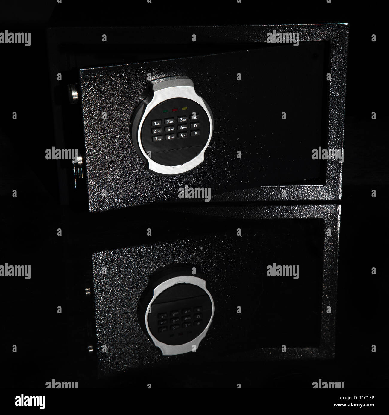 Close Money Safe on black background Stock Photo - Alamy