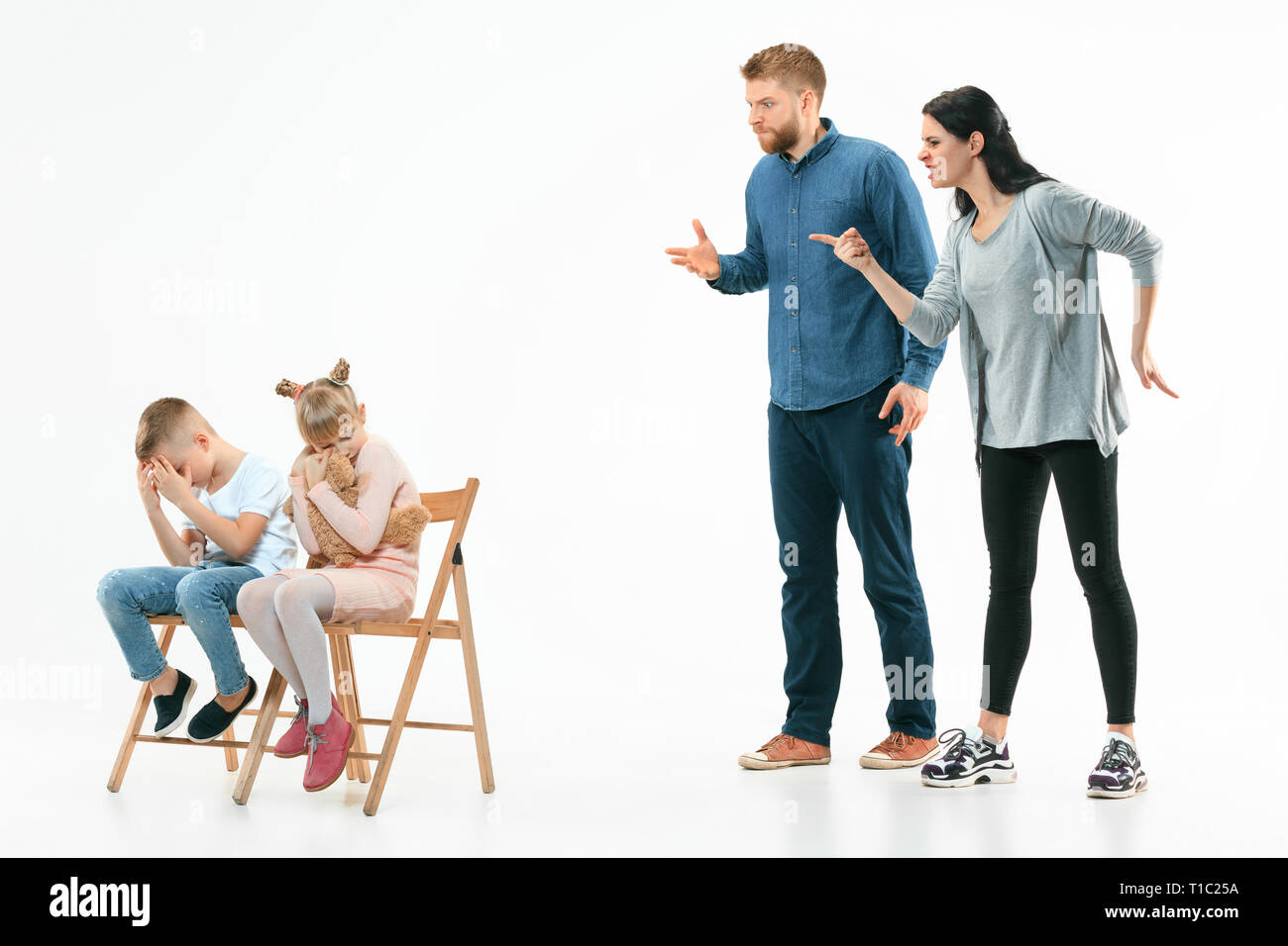 Angry parents scolding their children - son and daughter at home ...