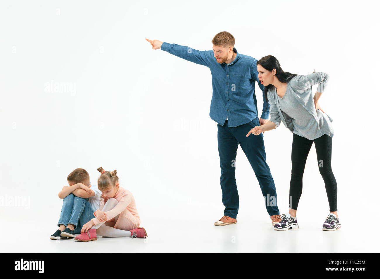 Angry parents scolding their children - son and daughter at home ...