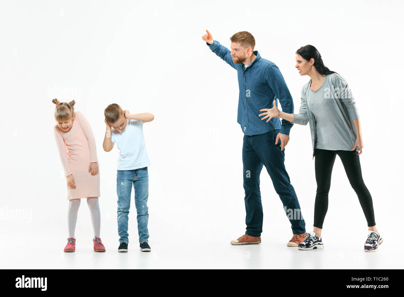 Angry parents scolding their children - son and daughter at home ...