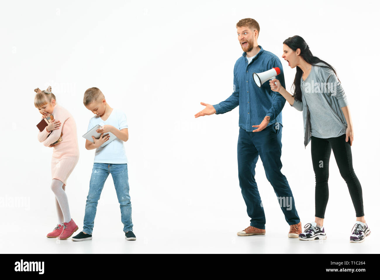 Angry parents scolding their children - son and daughter at home ...
