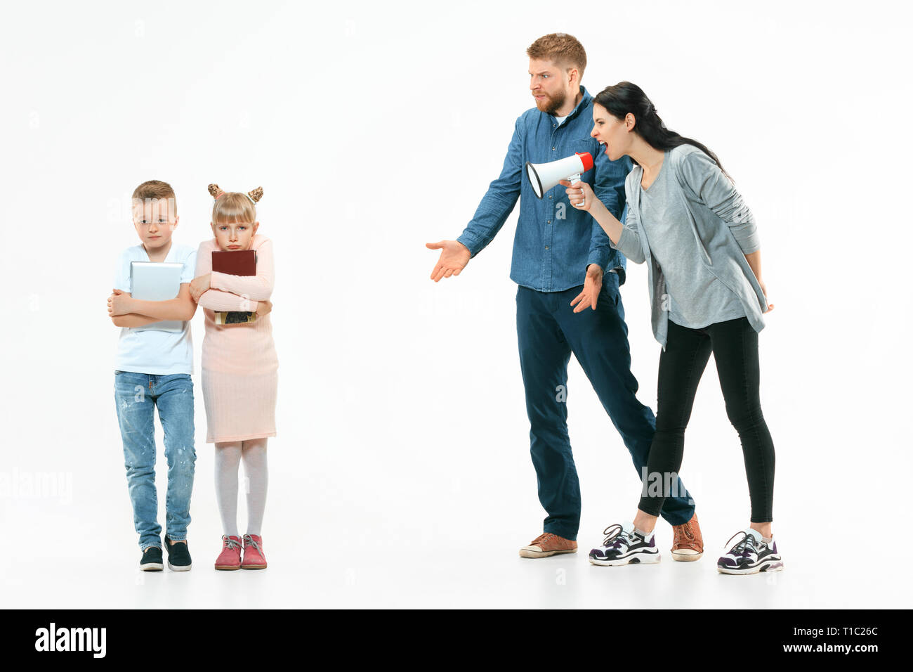 Angry parents scolding their children - son and daughter at home ...