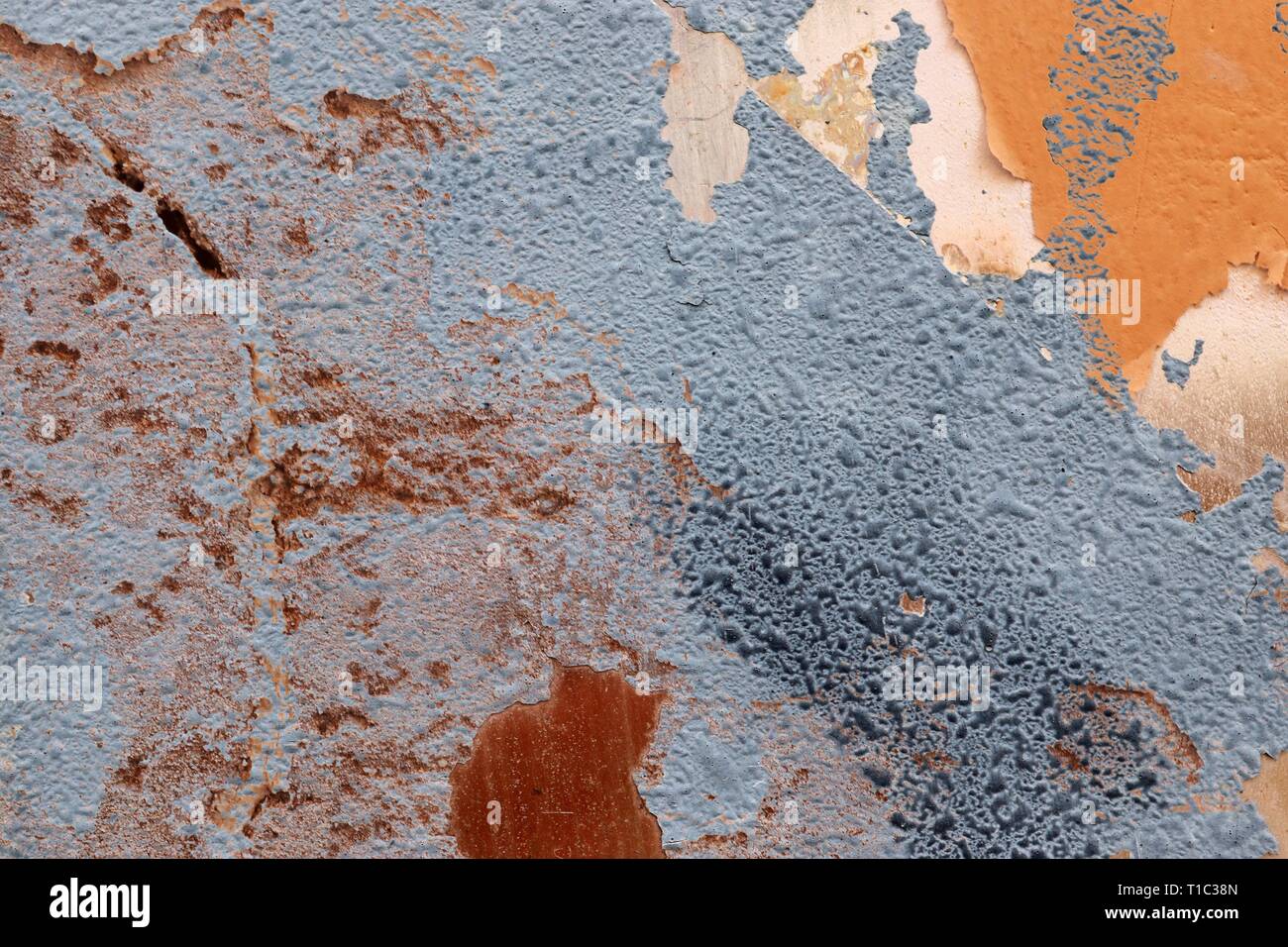 Close up detailed surface of weathered paint on different walls in high ...