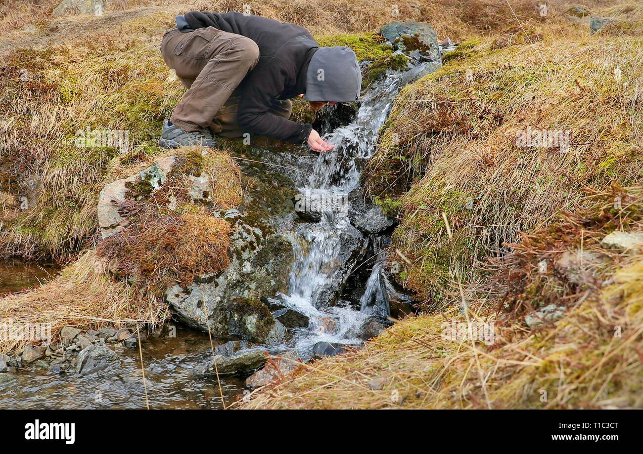 Man drinking water waterfall hi-res stock photography and images - Alamy