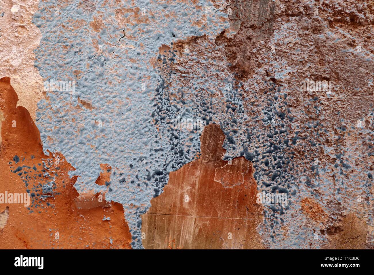 Close up detailed surface of weathered paint on different walls in high ...