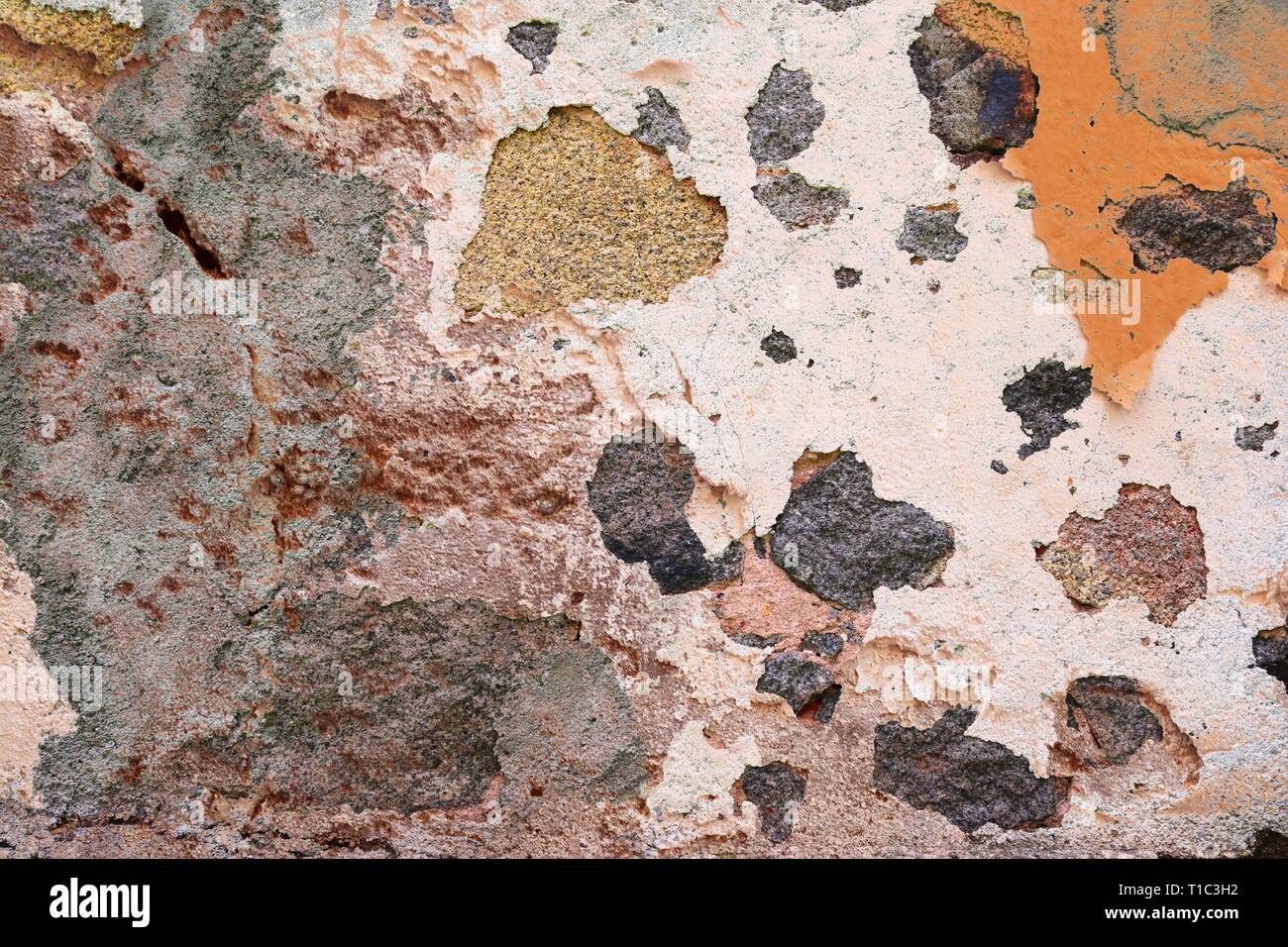 Close up detailed surface of weathered paint on different walls in high ...