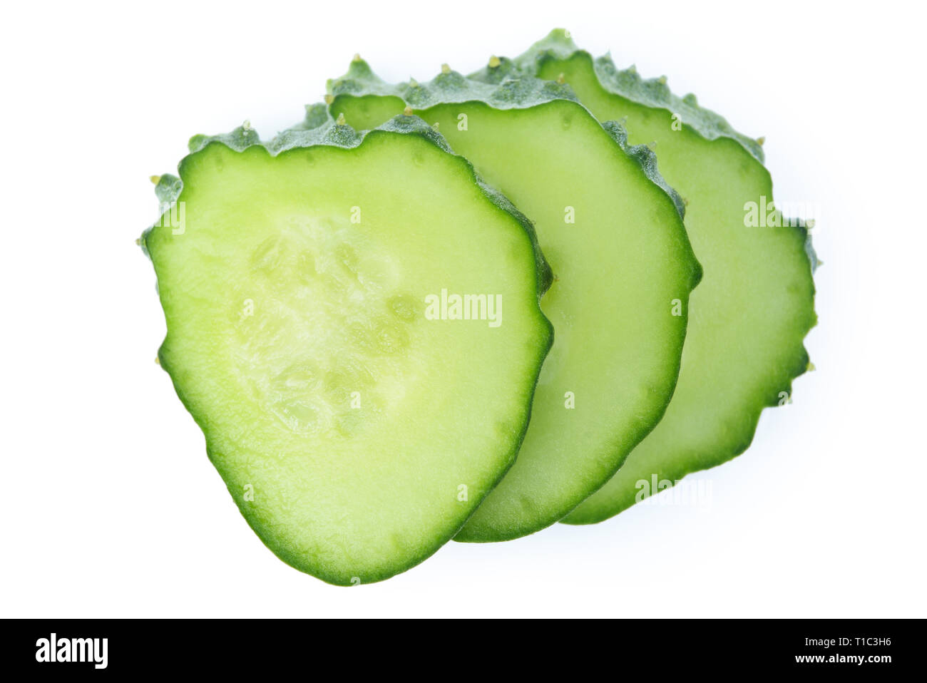 Three slices of fresh cucumber. Isolated on white background Stock ...