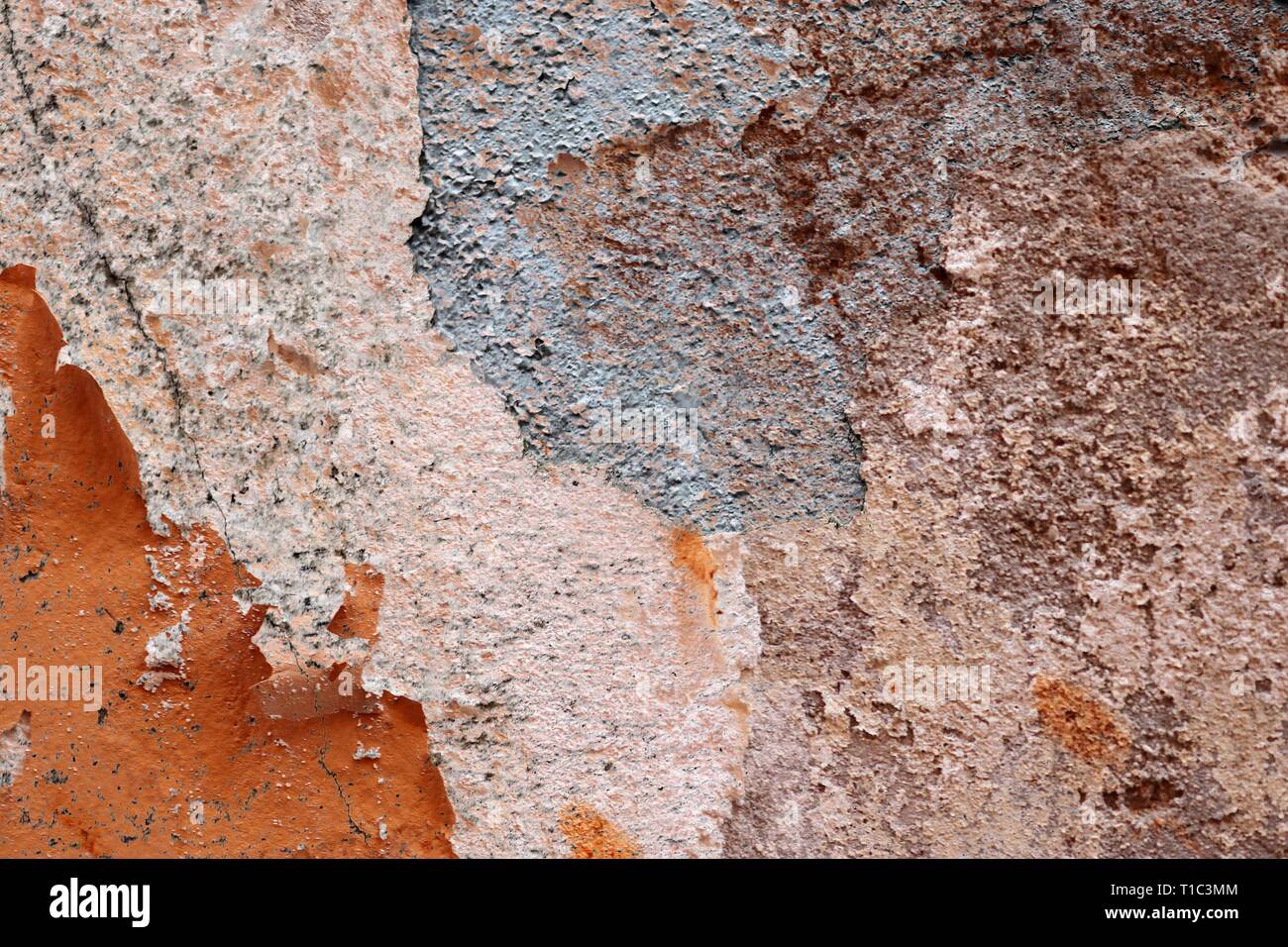 Close up detailed surface of weathered paint on different walls in high ...