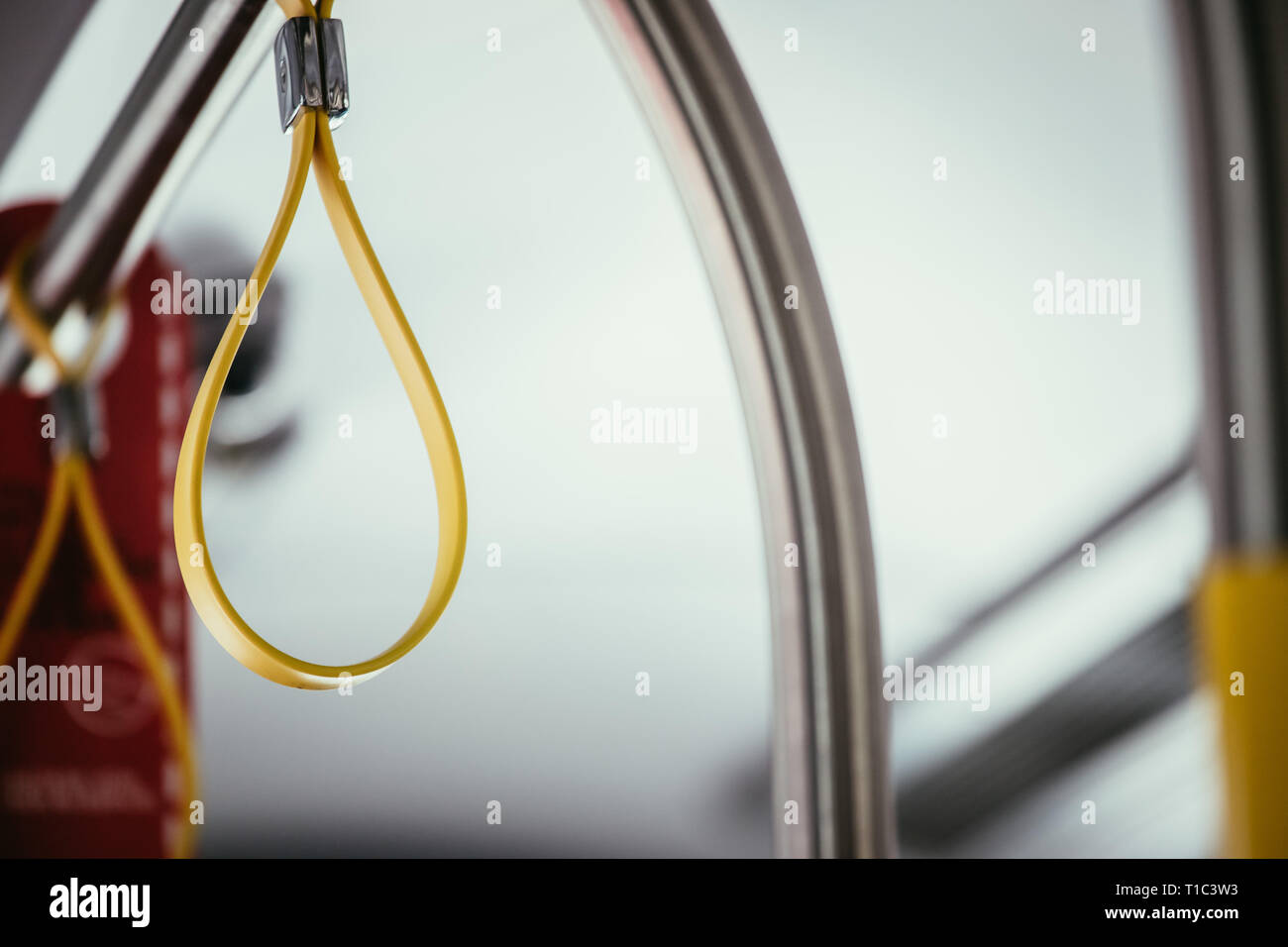 Hold on straps in a bus, commuting, public transport Stock Photo - Alamy
