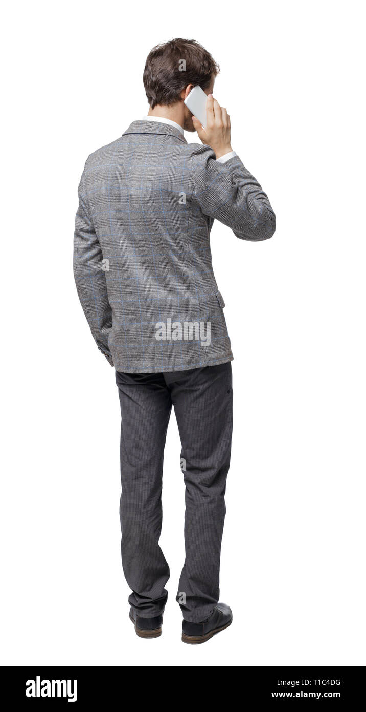 back view of business man in suit talking on mobile phone. rear view ...