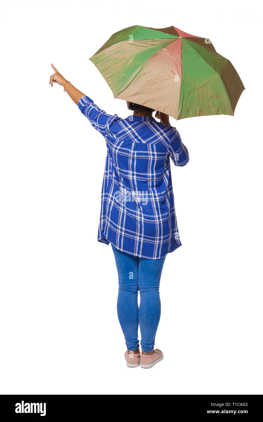 Back view of a black African-American woman under an umbrella points ...