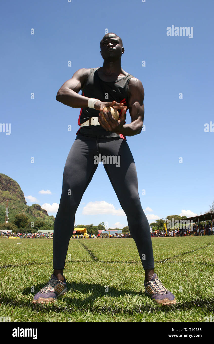 An athlete competing in the shot put event during an athletics national ...