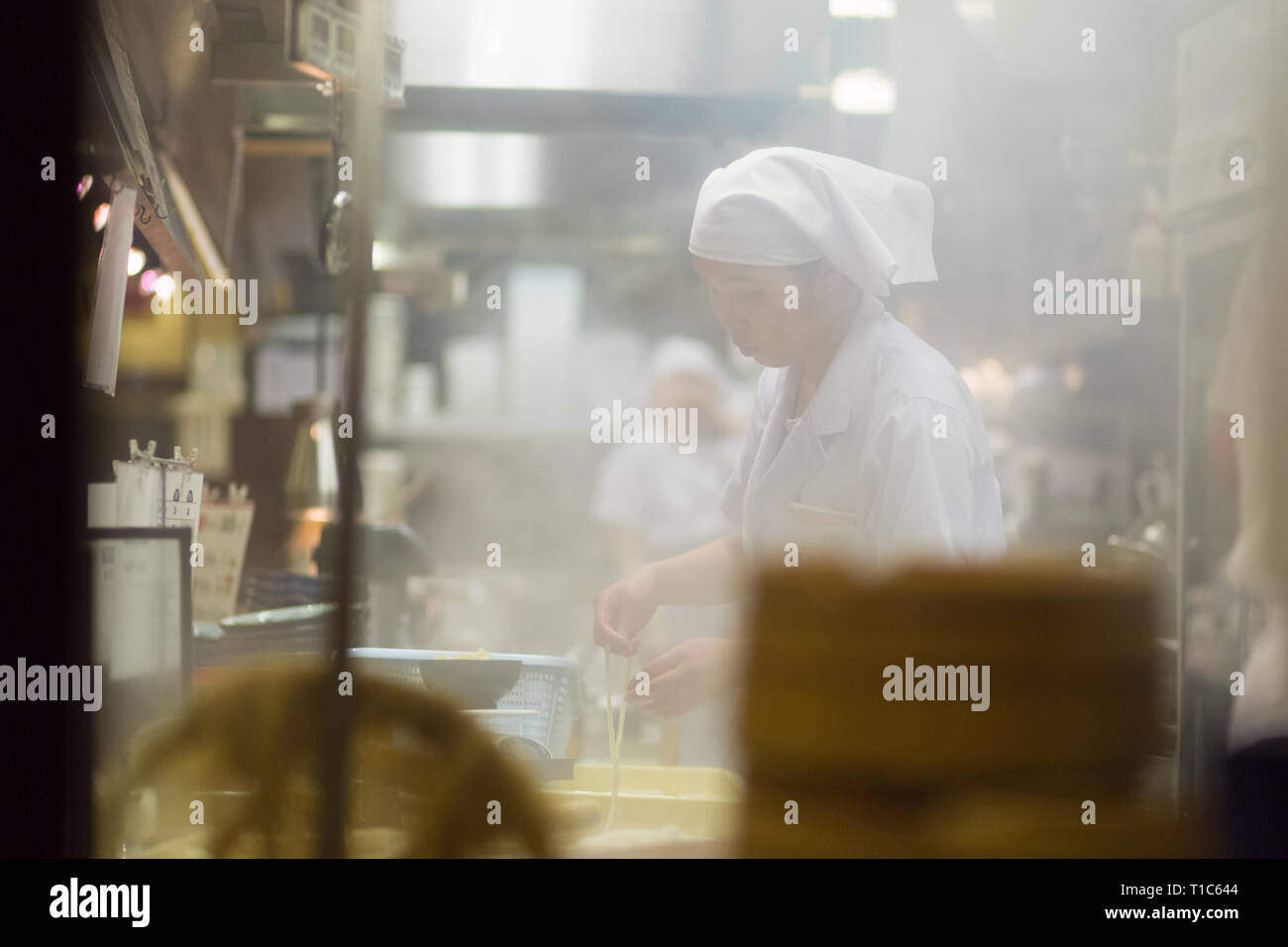 Japanese Ramen chefs prepare a bowl of traditional home made ramen ...