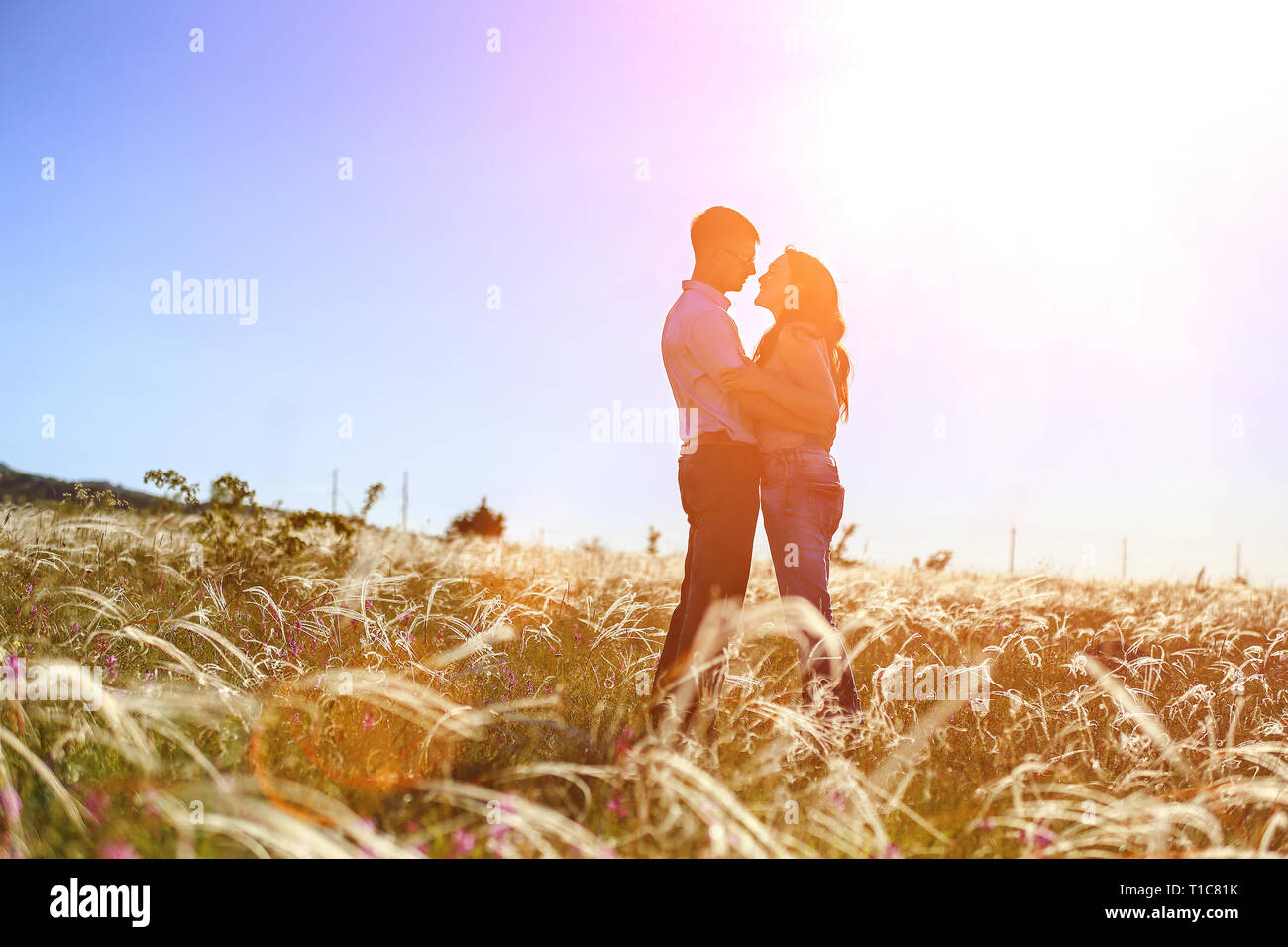 couple man and woman relationship in nature in the setting sun Stock ...