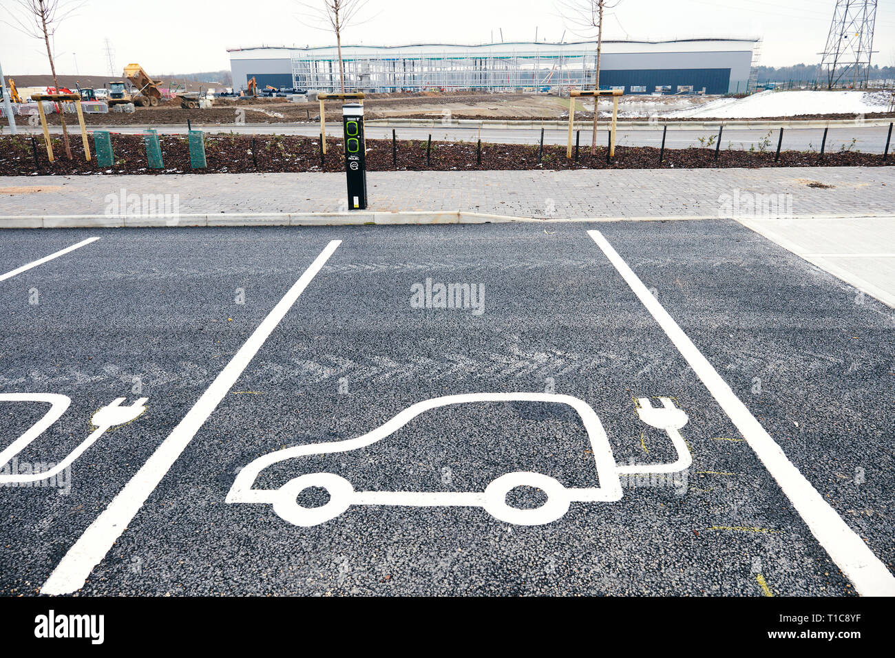 Electric Car charging station and car parking space Stock Photo - Alamy