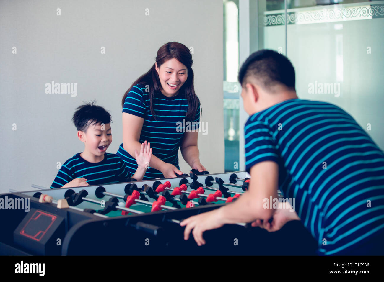 Kid playing soccer table game hi-res stock photography and images - Alamy
