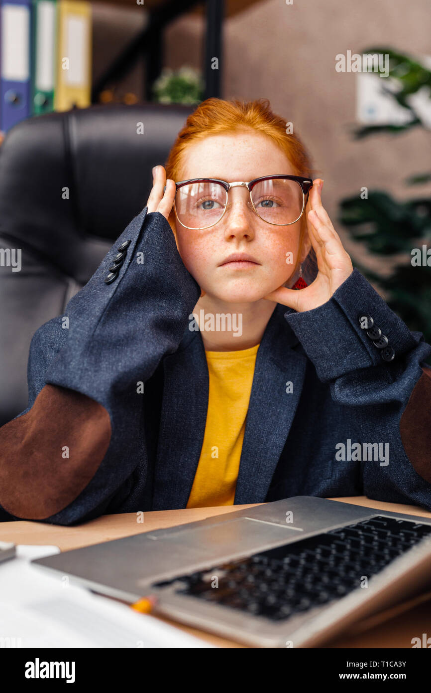 Nice good looking girl thinking about her future work Stock Photo - Alamy